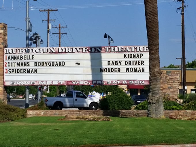 The marquee doesn't just list movies—it broadcasts possibilities for your evening, from superhero adventures to romantic comedies.