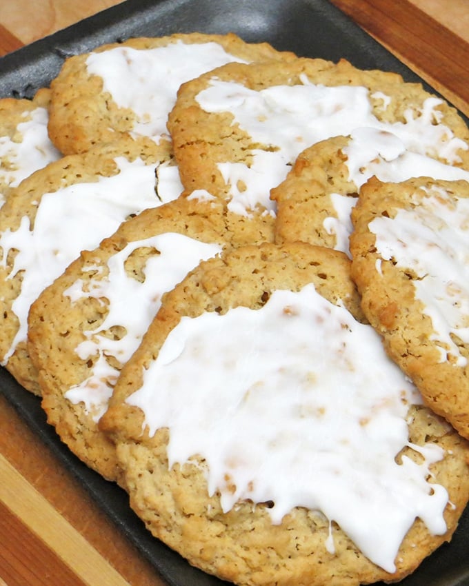 Oatmeal cookies that look like they've been blessed by the dairy gods. That glaze isn't just icing—it's the difference between a good day and a great one.