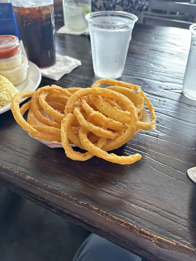 These onion rings aren't just side dishes—they're golden halos of crispy perfection that make you question why you ever settled for less.