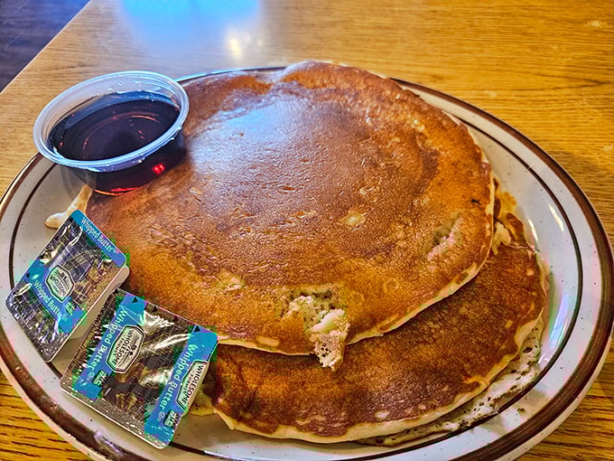 Golden-brown pancakes the size of frisbees – because sometimes breakfast should double as an Olympic sport.