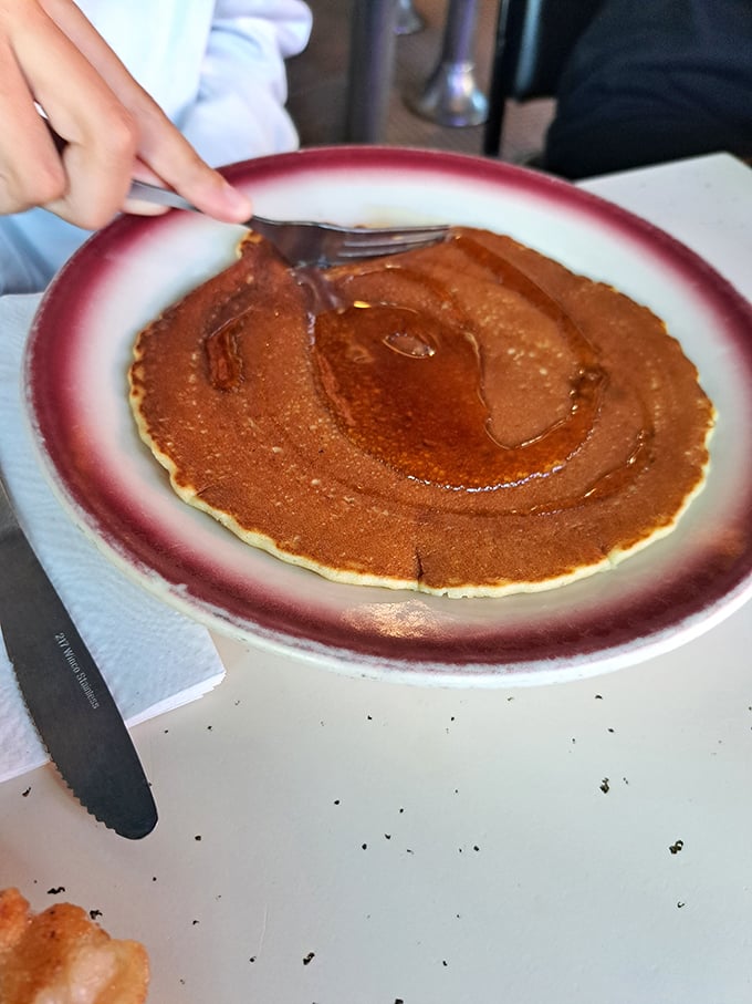 That perfect golden-brown pancake isn't just breakfast—it's a canvas awaiting its maple syrup masterpiece.