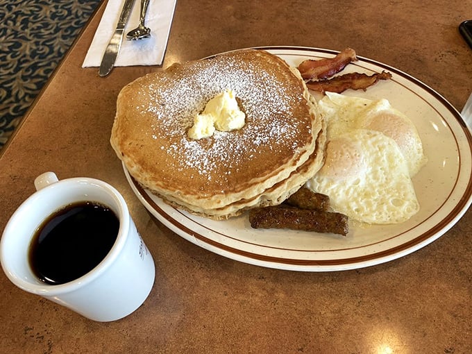 Pancakes dusted with powdered sugar and a pat of butter melting into golden perfection—breakfast's version of a standing ovation.
