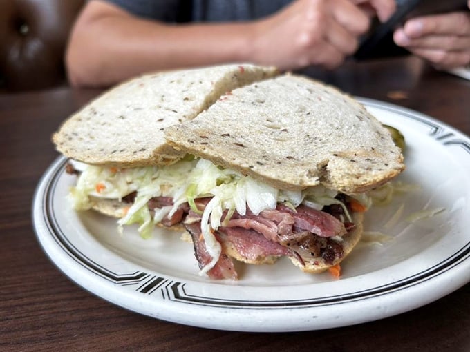 The legendary #19 in all its glory—where hand-cut pastrami, coleslaw, and Russian dressing create a sandwich worth crossing county lines for.