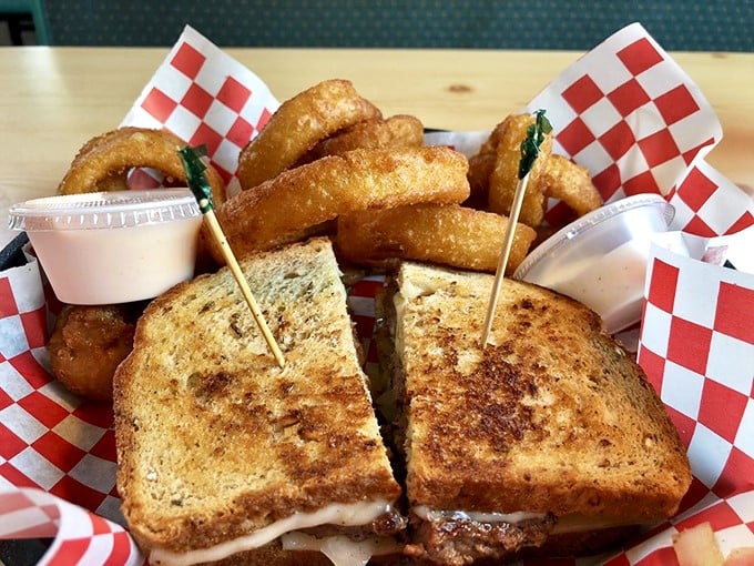 That perfect grilled cheese isn't just lunch—it's childhood nostalgia with grown-up execution. Those onion rings? The crispy halos of heaven.