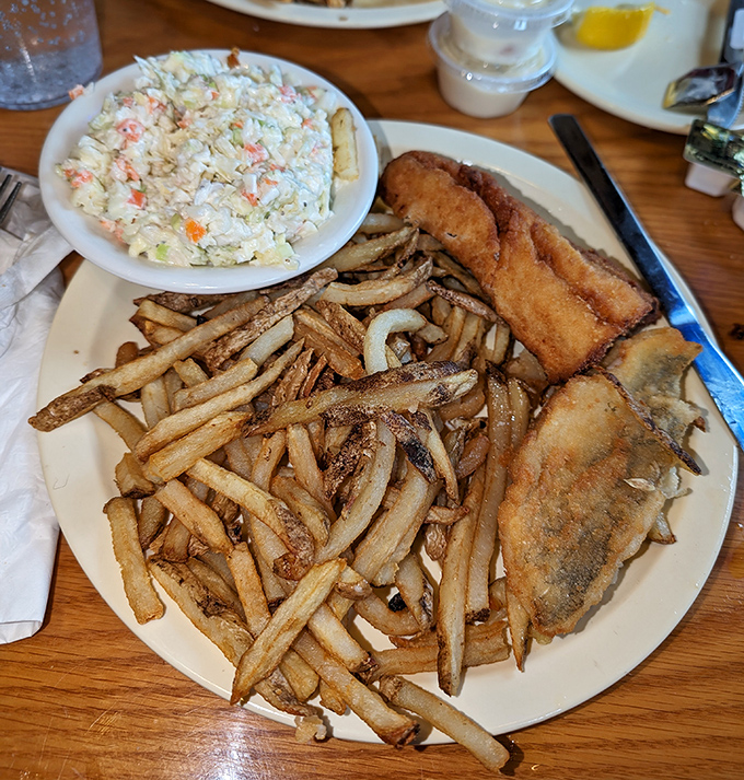 Golden-fried perfection meets homestyle coleslaw in this perch dinner – proof that sometimes the simplest preparations let fresh Lake Erie fish shine brightest.