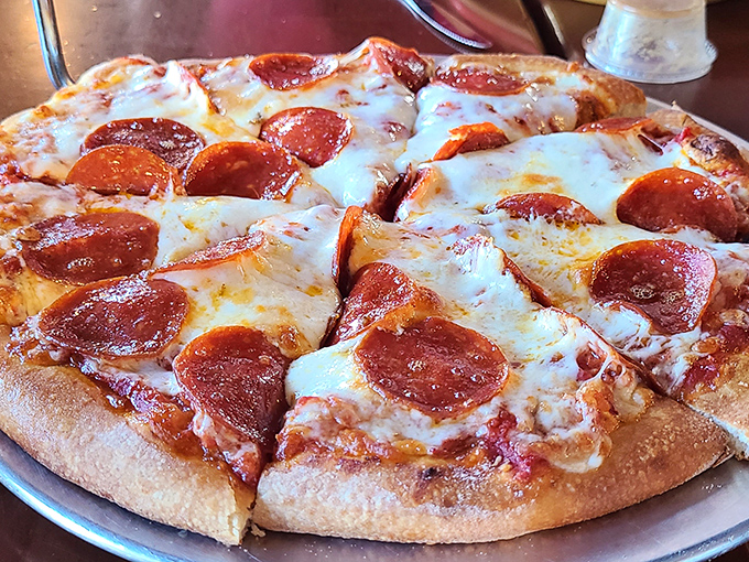 Golden pepperoni cups pooling with spicy oil on bubbly cheese—this is what pizza dreams are made of, folks.