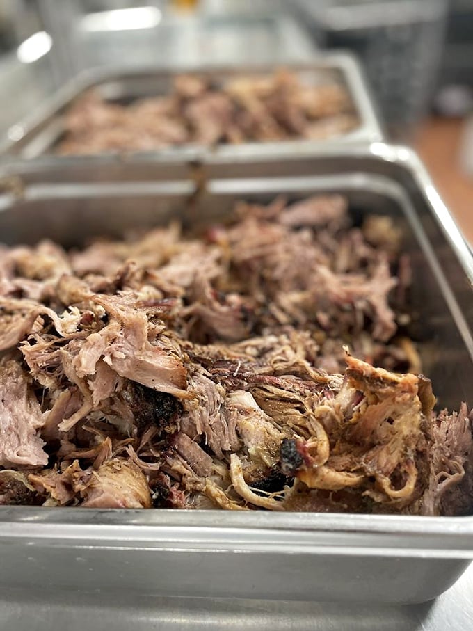 Pulled pork that doesn't just fall apart—it practically introduces itself to your taste buds. Each strand tells a story of smoke, time, and patience.