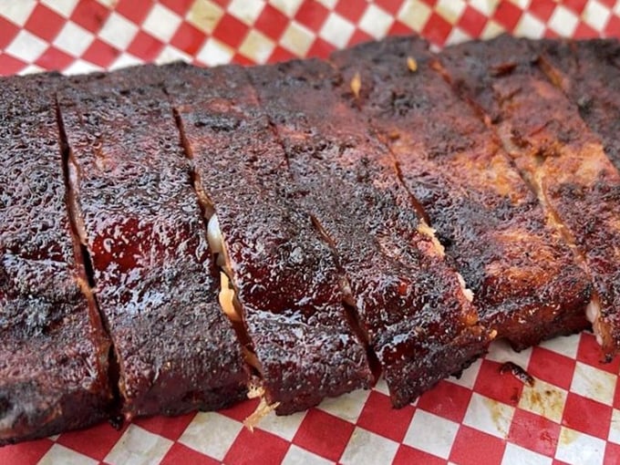 These ribs don't just fall off the bone—they practically leap into your mouth, their bark as perfect as a symphony's final note.