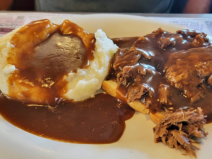 This isn't just pot roast – it's a hug on a plate. Tender meat swimming in rich gravy alongside fluffy mashed potatoes.