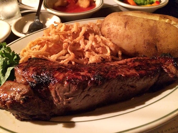 This isn't just a steak—it's a masterpiece with a side of crispy onion strings. The kind of meal that makes vegetarians question their life choices.