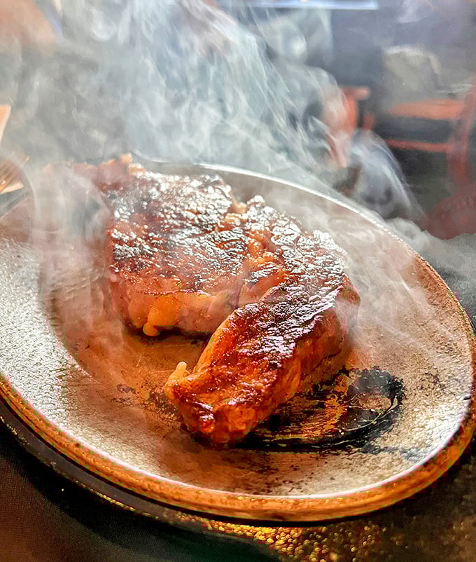 Sizzling steak perfection that makes you want to write poetry. That steam isn't just vapor—it's applause rising from a perfectly cooked piece of beef.