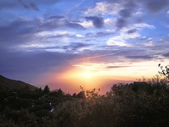 Mother Nature's grand finale—a sunset that turns the sky into a watercolor masterpiece, painting the mountains in shades no Instagram filter could improve.