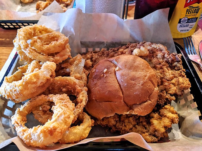 Golden-fried onion rings and a sandwich that's practically bursting at the seams – this is what happens when comfort food gets serious.
