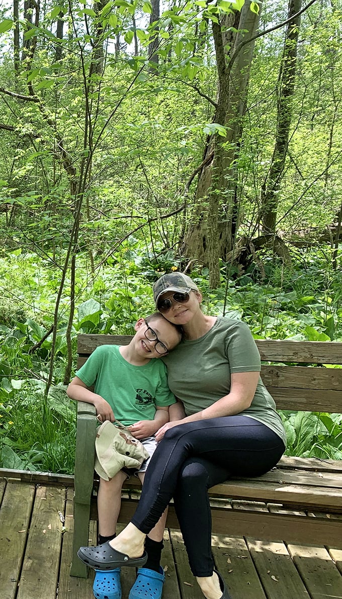 Moments of connection in nature's embrace. A peaceful bench along the boardwalk offers the perfect spot for visitors to pause and absorb the preserve's tranquil beauty.