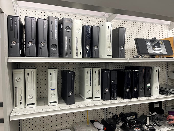 Gaming history lines these shelves—each console representing thousands of hours of entertainment now available for less than the cost of a new release.