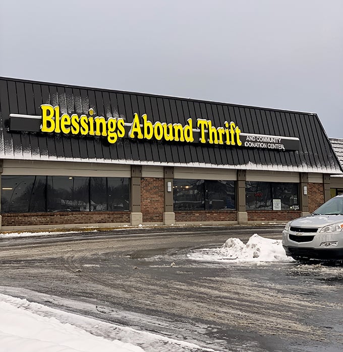 Blessings Abound indeed—that cheerful yellow sign promises sunshine for your wallet even on snowy days.
