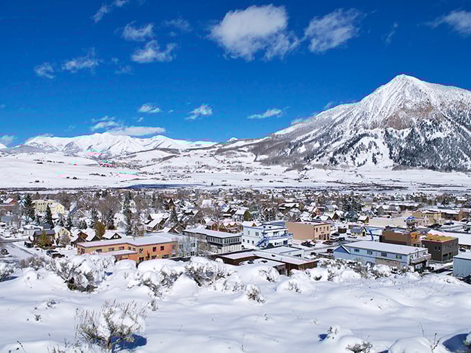 This cozy mountain town sparkles in twilight like scattered diamonds against the snowy Colorado landscape.