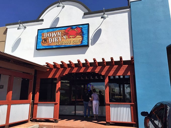 Down N Dirty's colorful Southwest-meets-seafood vibe is pure New Mexico magic. That wooden pergola practically says "come get messy!"