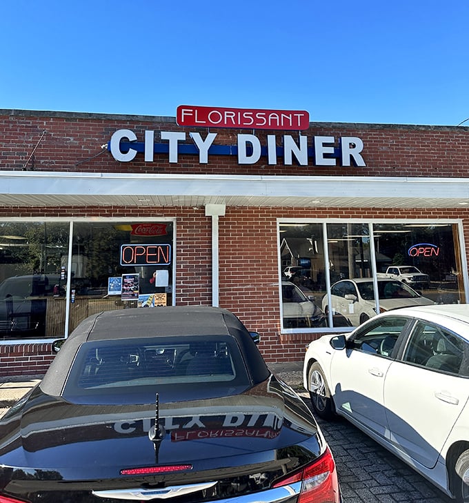 That bold red "BEST BURGERS IN TOWN" sign isn't just bragging—it's a promise that's kept between two perfectly toasted buns.