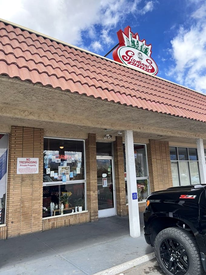 Giovanni's classic brick building houses pizza treasures that would make any New Yorker homesick. That red roof means red sauce magic awaits!