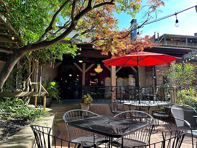 Under the shade of red umbrellas and leafy branches, Guarino’s patio offers a timeless setting for leisurely meals and lively conversation.
