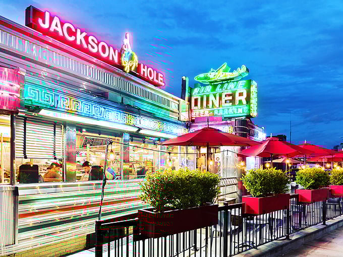 Neon signs and aluminum siding create the perfect backdrop for airport-adjacent breakfast adventures.