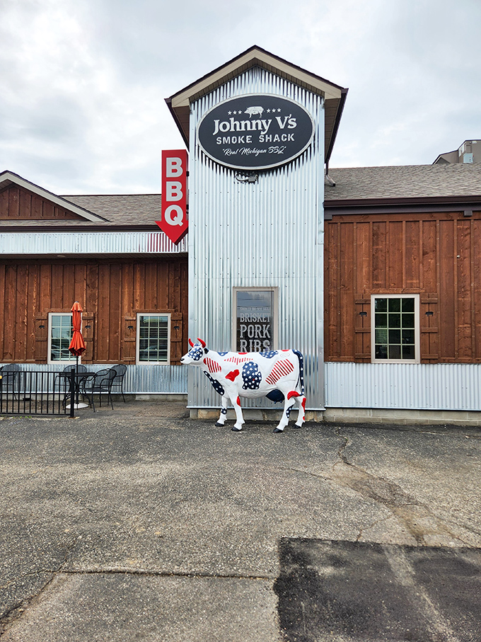 Johnny V's rustic charm comes complete with a patriotic cow guardian – because great BBQ deserves a proper mascot.