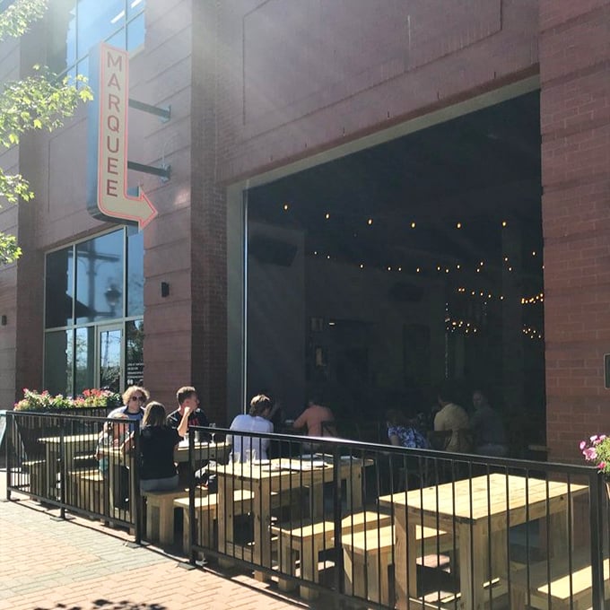 Marquee's inviting patio – where pizza becomes an event. Those string lights aren't the only things glowing with warmth here.