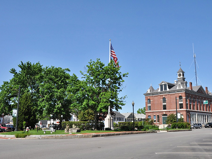 White church spires pierce blue skies like beacons guiding travelers to small-town serenity.