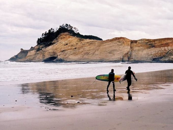 Surfers, sandstone, and endless sky. This beach knows how to throw a party every single day.