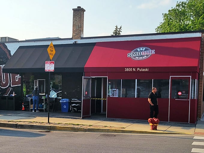 Smoque's classic red awning stands like a beacon of hope for Chicago's serious barbecue enthusiasts – no frills, just smoky thrills.