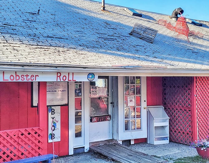 The Lobster Pool's cherry-red exterior is like a love letter to seafood – casual, straightforward, and promising a romance with your taste buds.