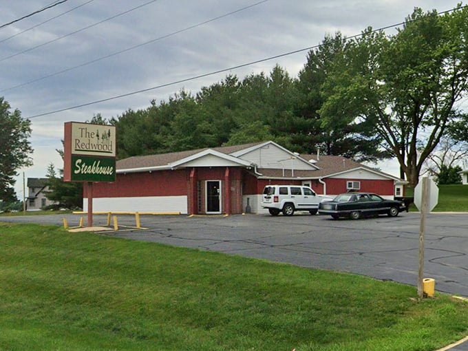 The Redwood's modest roadside appearance belies the beefy treasures within – where prime rib is religion and portion control is just a suggestion.
