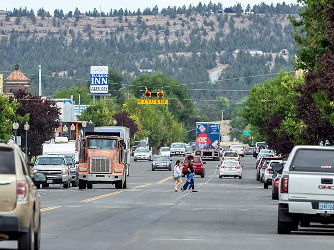 Traffic flows through Alturas' sun-baked corridor while pine-dotted hills remind visitors they're at the edge of wilderness—civilization's last handshake.