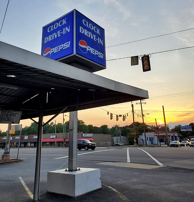 Sunset at the Clock Drive-In—where the golden hour meets golden onion rings in perfect harmony.
