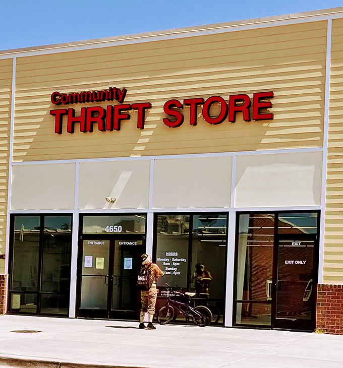 Bright red letters against yellow siding – this Community Thrift Store stands out like a beacon for savvy shoppers.