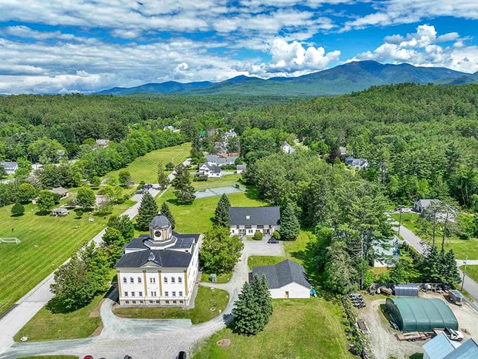 This aerial perspective captures small-town America at its finest, where community buildings anchor neighborhoods like trusted old friends.