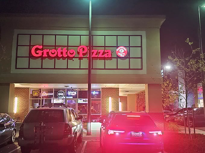 By day or night, Grotto's glowing storefront beckons with promises of that signature swirl of sauce.