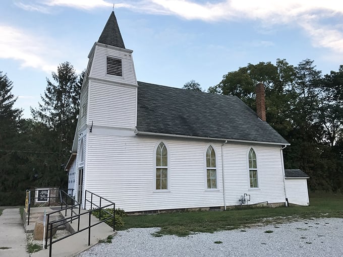Heavenly simplicity! This pristine white chapel in Laketon stands like a wedding cake against the Indiana sky, serving spiritual comfort with a side of architectural nostalgia.