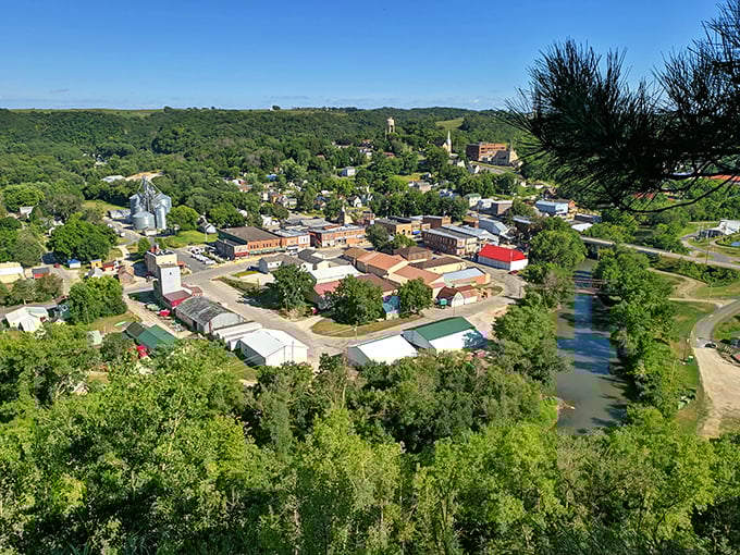 Those bluffs cradle this little town like nature's own protective embrace, creating pure valley magic below.