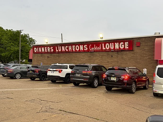 Behind that unassuming brick exterior lies decades of Detroit pizza tradition at Loui's.