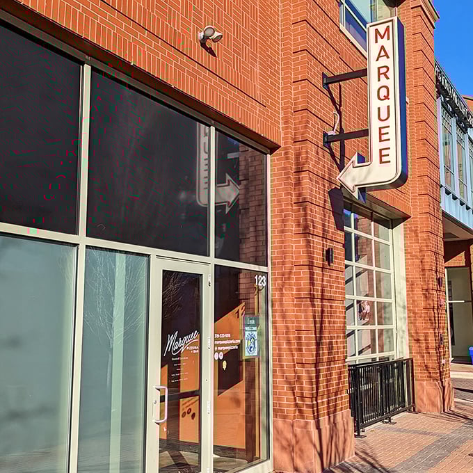 Urban cool meets pizza perfection at Marquee. That arrow sign points the way to wood-fired wonders.