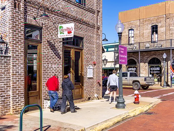 Nacogdoches' downtown glows charmingly, the historic buildings creating a perfect small-town silhouette against the dramatic Texas sky.