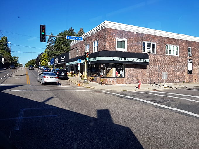 Sunlight bathes this brick building housing Nu Look Apparel – a boutique experience at thrift store prices.