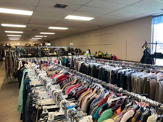 Behind the blue warehouse facade? A rainbow of organized clothing racks waiting to refresh your wardrobe.