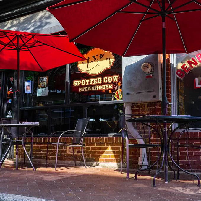 Red umbrellas and outdoor seating – because great steak deserves fresh air and people-watching opportunities.