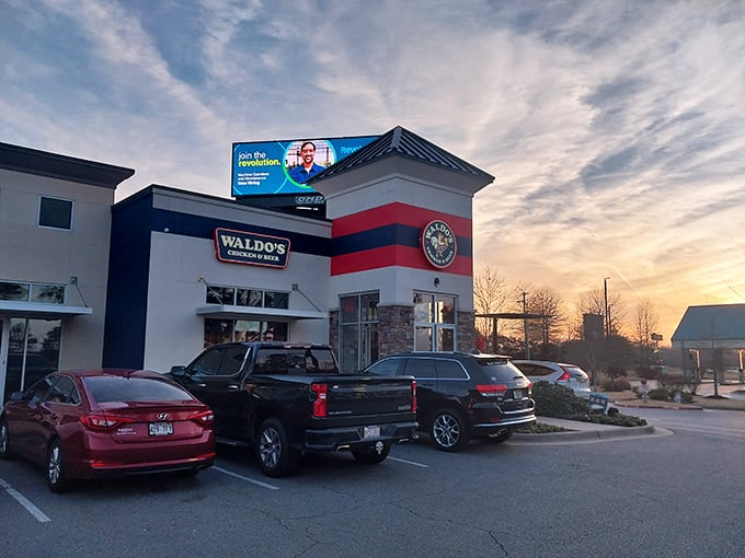 The sunset casts a golden glow on Waldo's – much like the perfect golden crust on their legendary chicken.