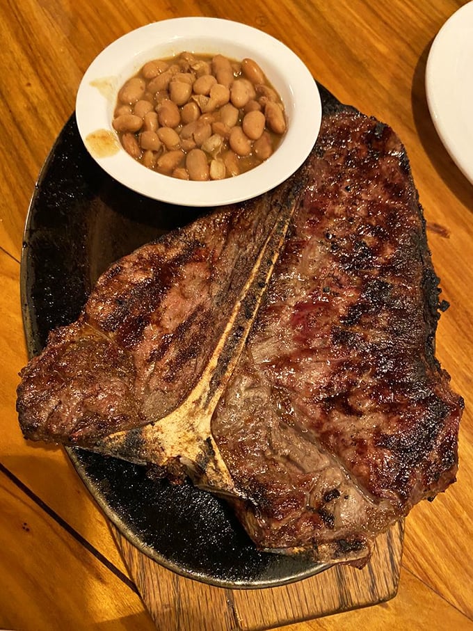 This porterhouse isn't just a steak, it's a commitment – a glorious slab of beef with a side of beans that knows its supporting role.