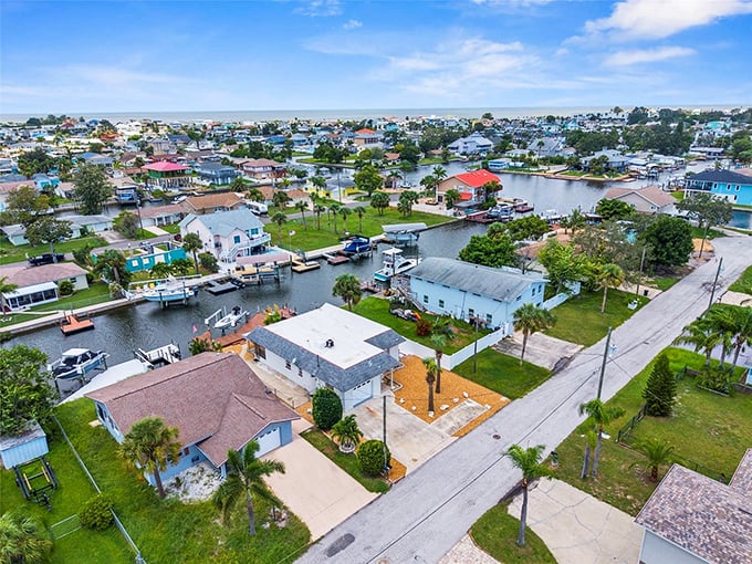 From above, Hudson reveals its watery DNA—a community where life flows with the tides and mailboxes sometimes require boat access.
