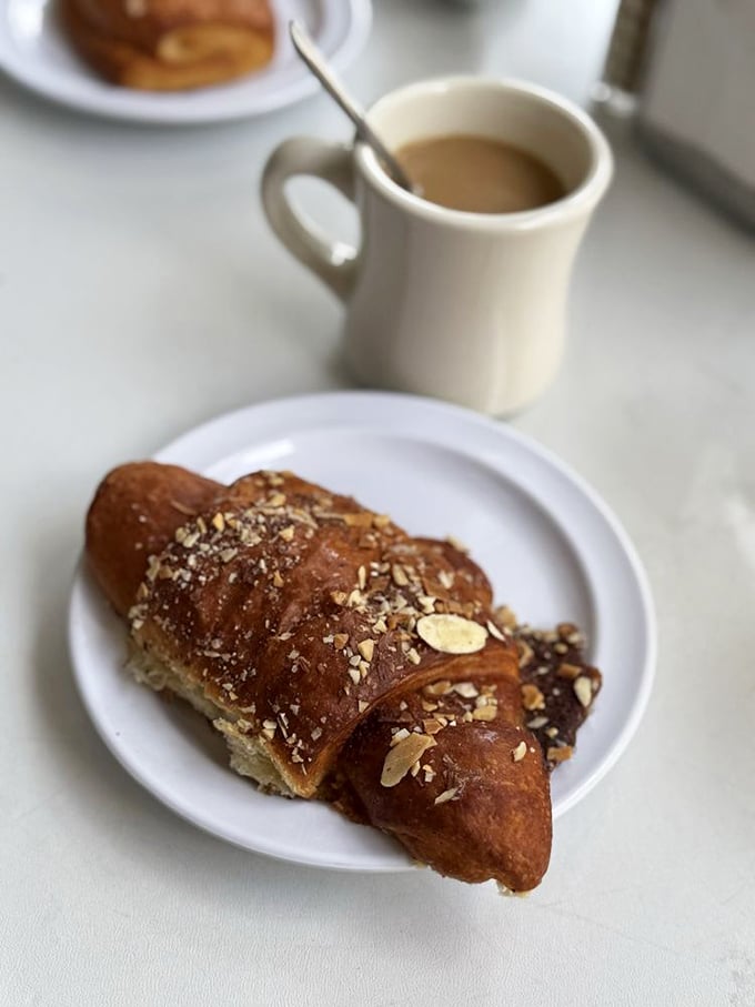 Sliced almonds, powdered sugar, and buttery perfection – this almond croissant is what angels eat when they're feeling fancy.